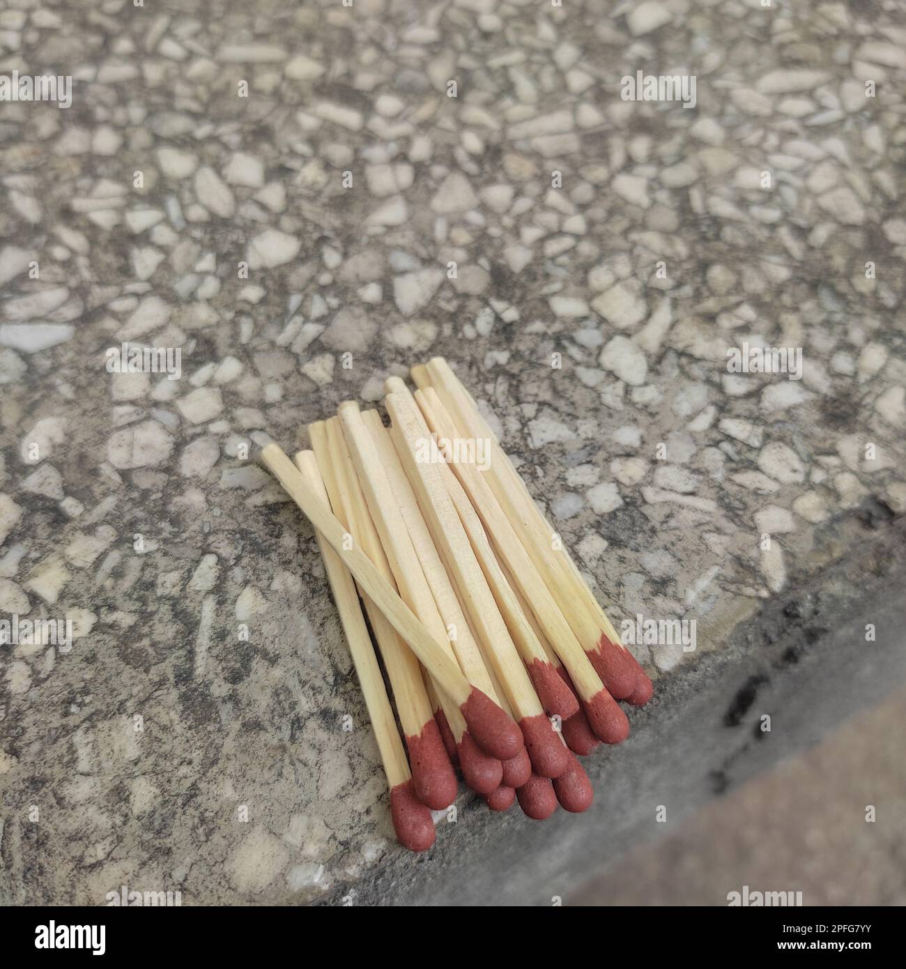 Close up of open single cardboard match box on granite stone background ...