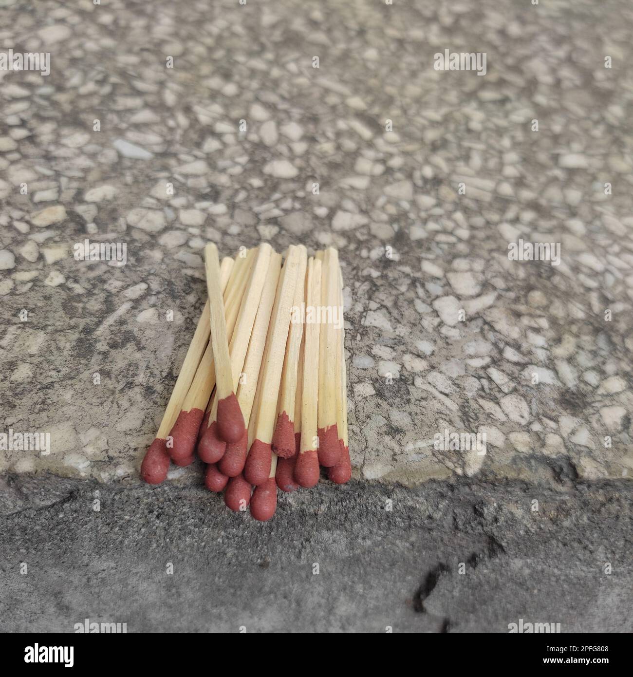 Close up of open single cardboard match box on granite stone background ...