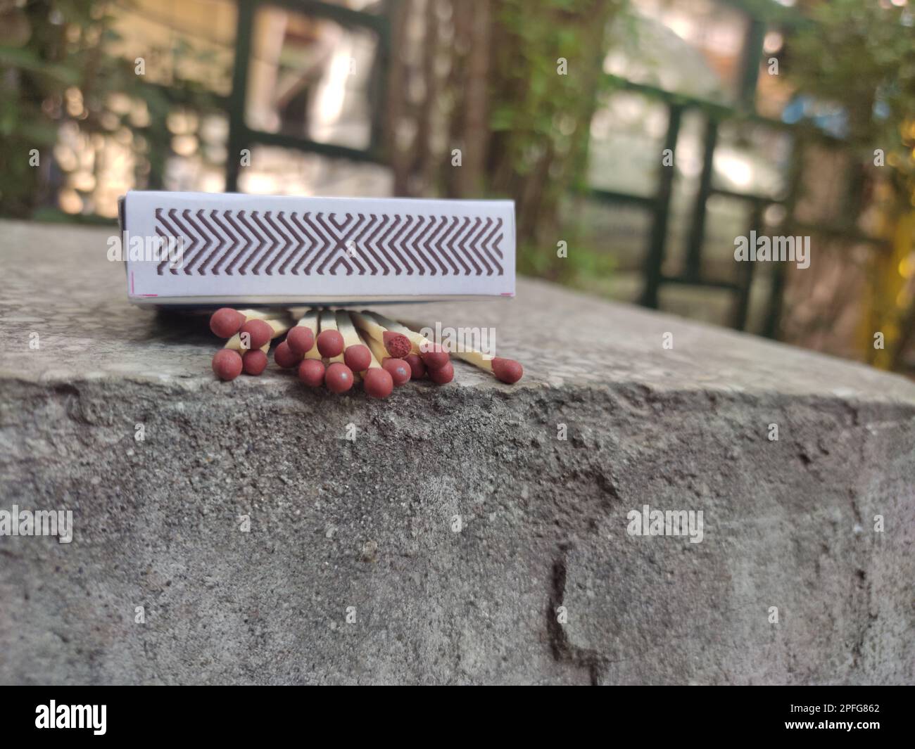 Close up of open single cardboard match box on granite stone background ...