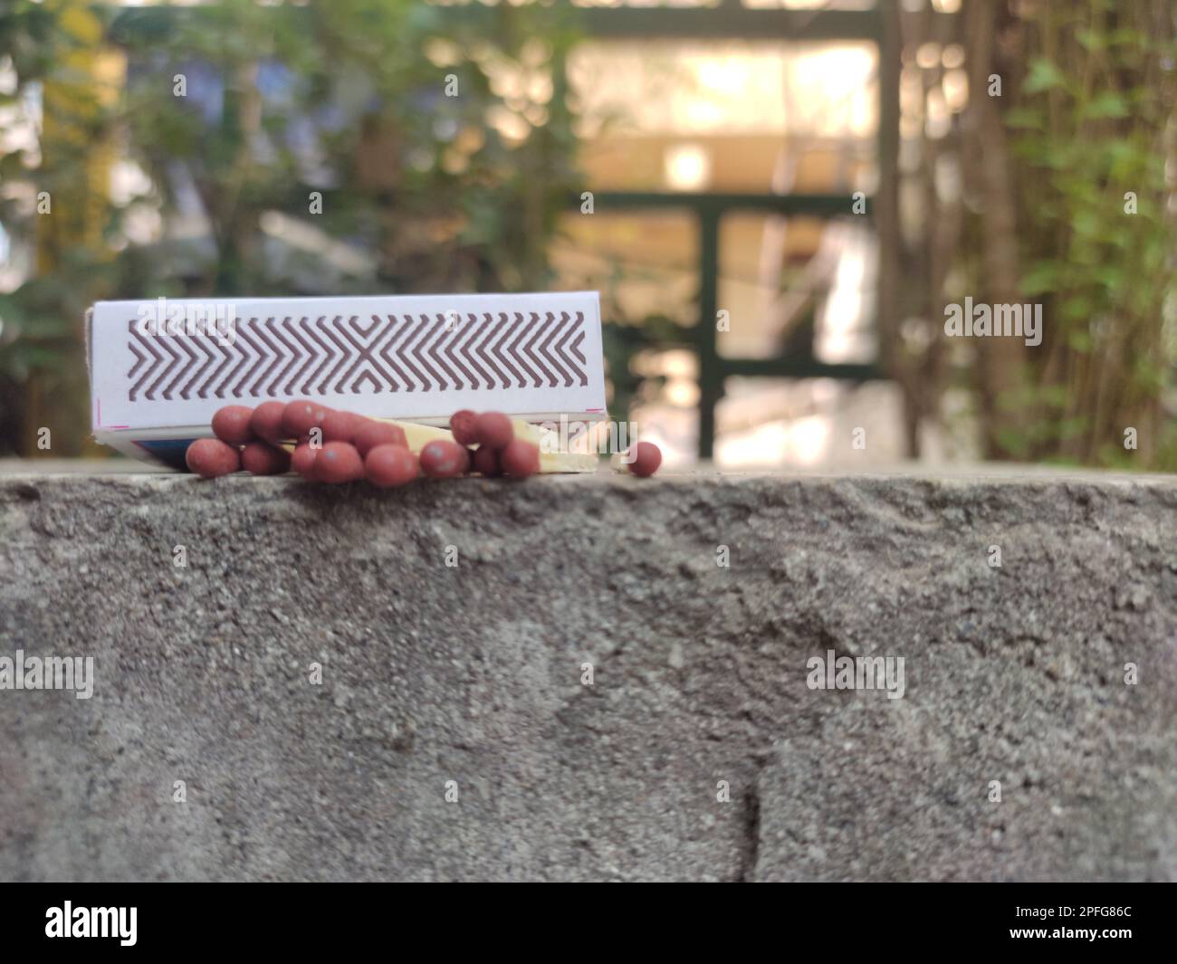 Close up of open single cardboard match box on granite stone background ...