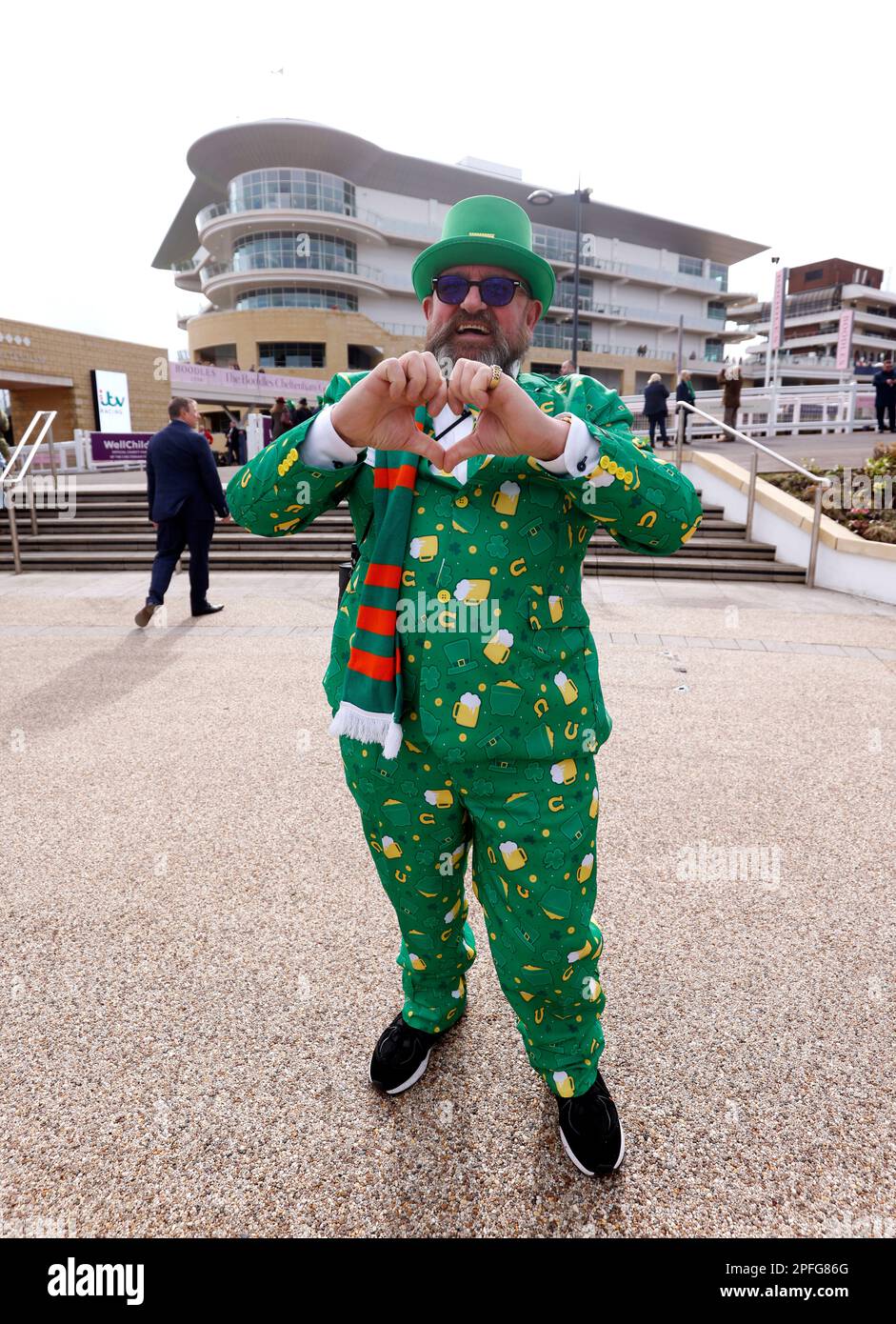 A racegoer wearing a St. Patrick's Day themed suit on day four of the ...