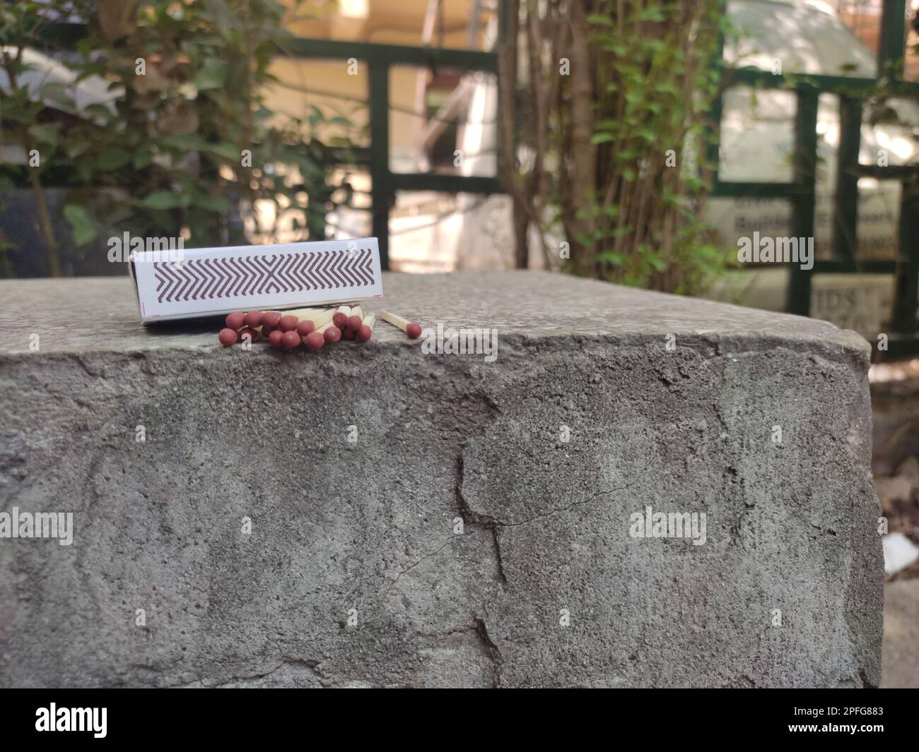 Close up of open single cardboard match box on granite stone background ...