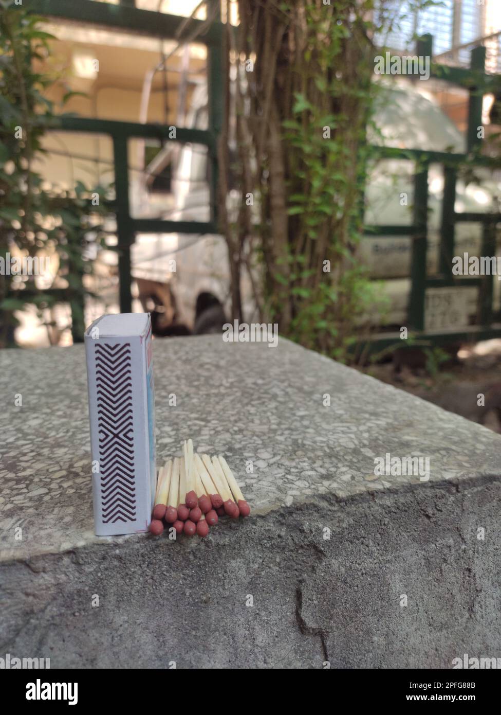 Close up of open single cardboard match box on granite stone background ...