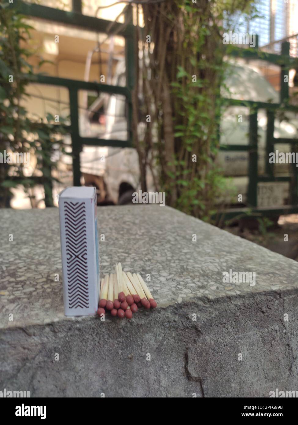 Close up of open single cardboard match box on granite stone background ...