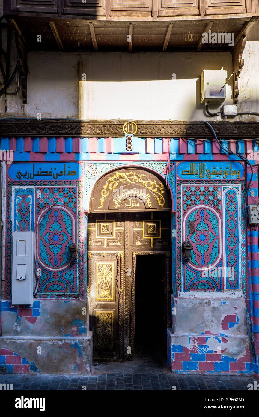 View of a beautiful ornate portal of an old coral house at the Al ...