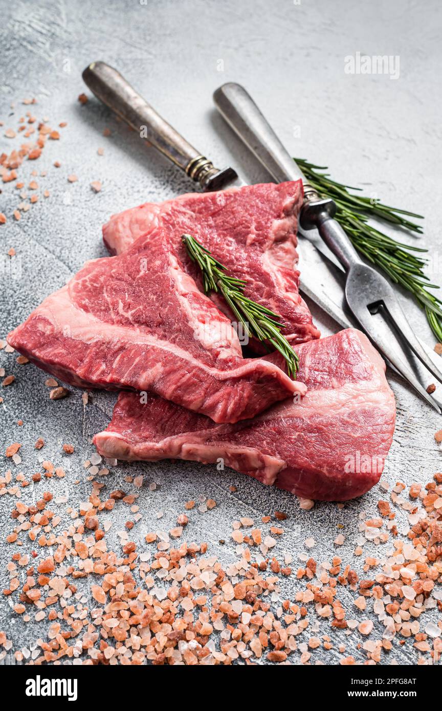 Silverside sirloin beef cut, raw meat on butcher table with herbs ...