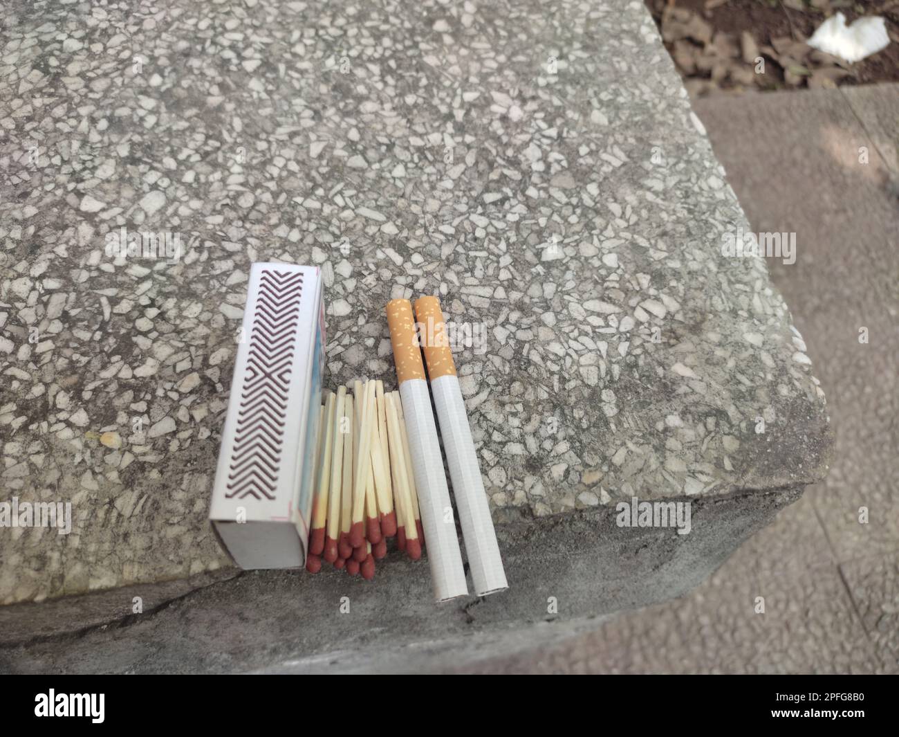 Close up of open single cardboard match box on granite stone background ...