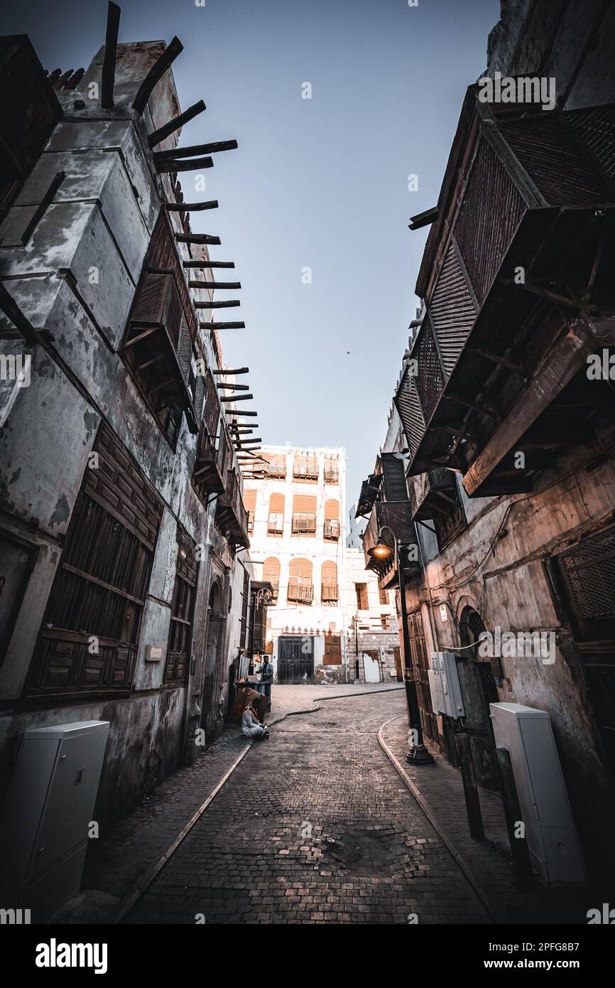 View of a run-down coral houses in a narrow street at the historic ...