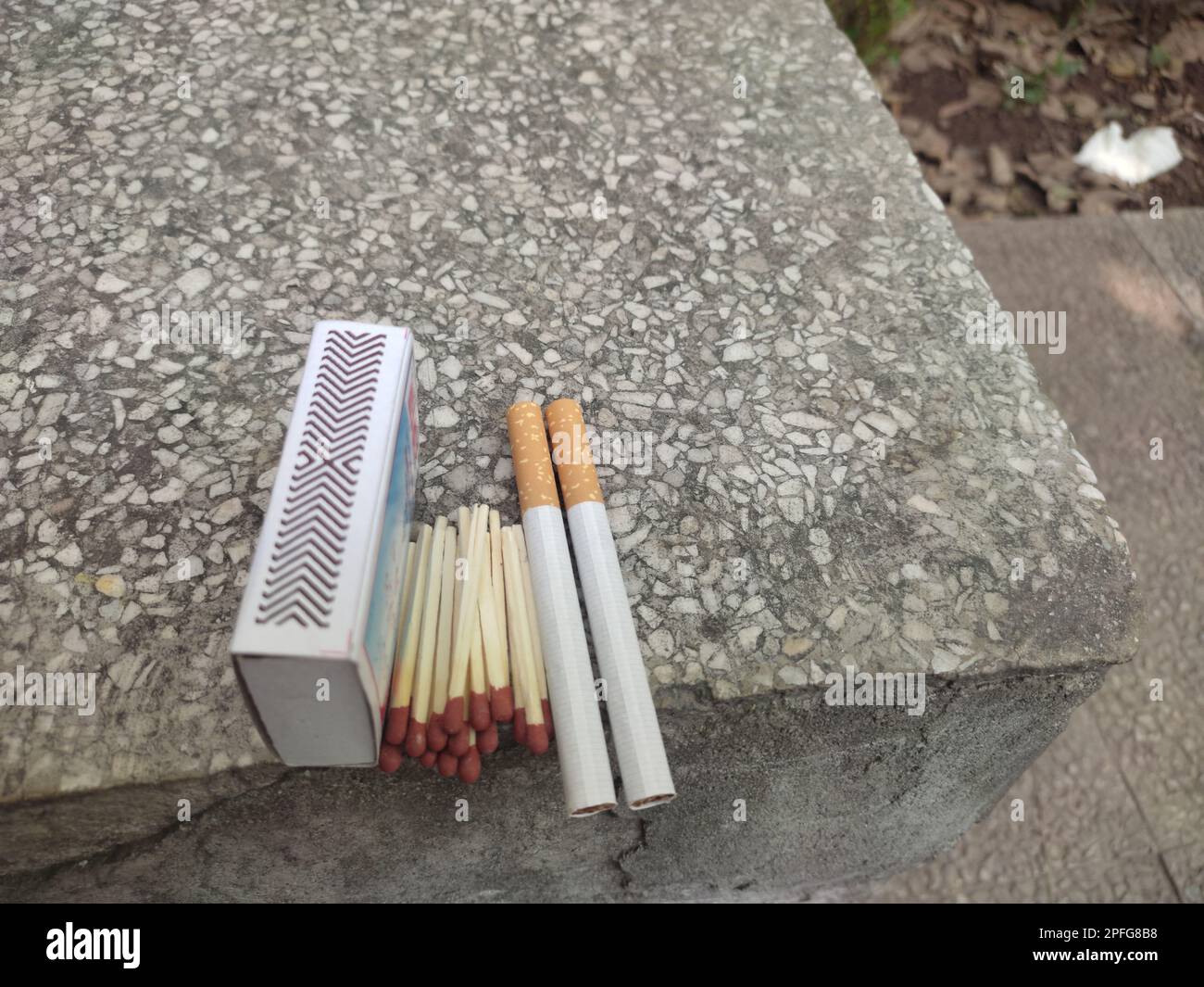 Close up of open single cardboard match box on granite stone background ...