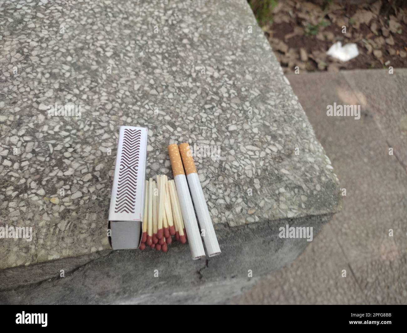 Close up of open single cardboard match box on granite stone background ...