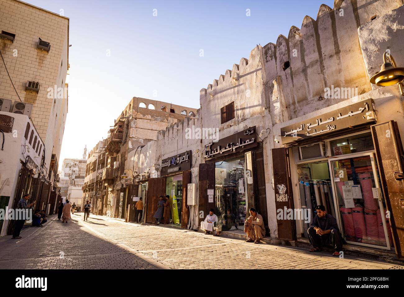Scenic evening view of the Suq Al Jami street with old coral town ...