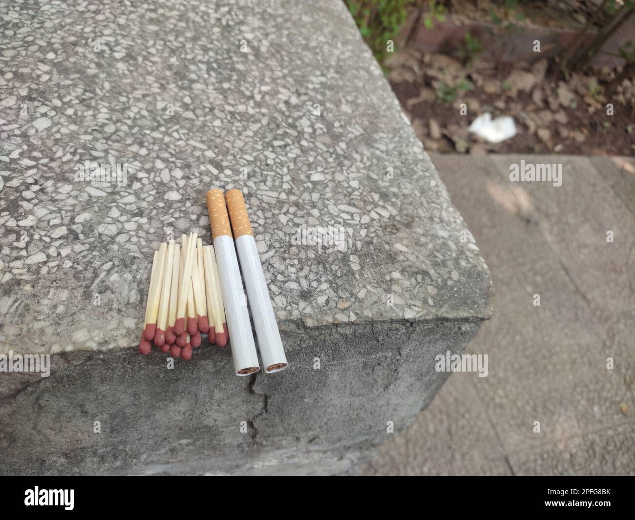 Close up of open single cardboard match box on granite stone background ...