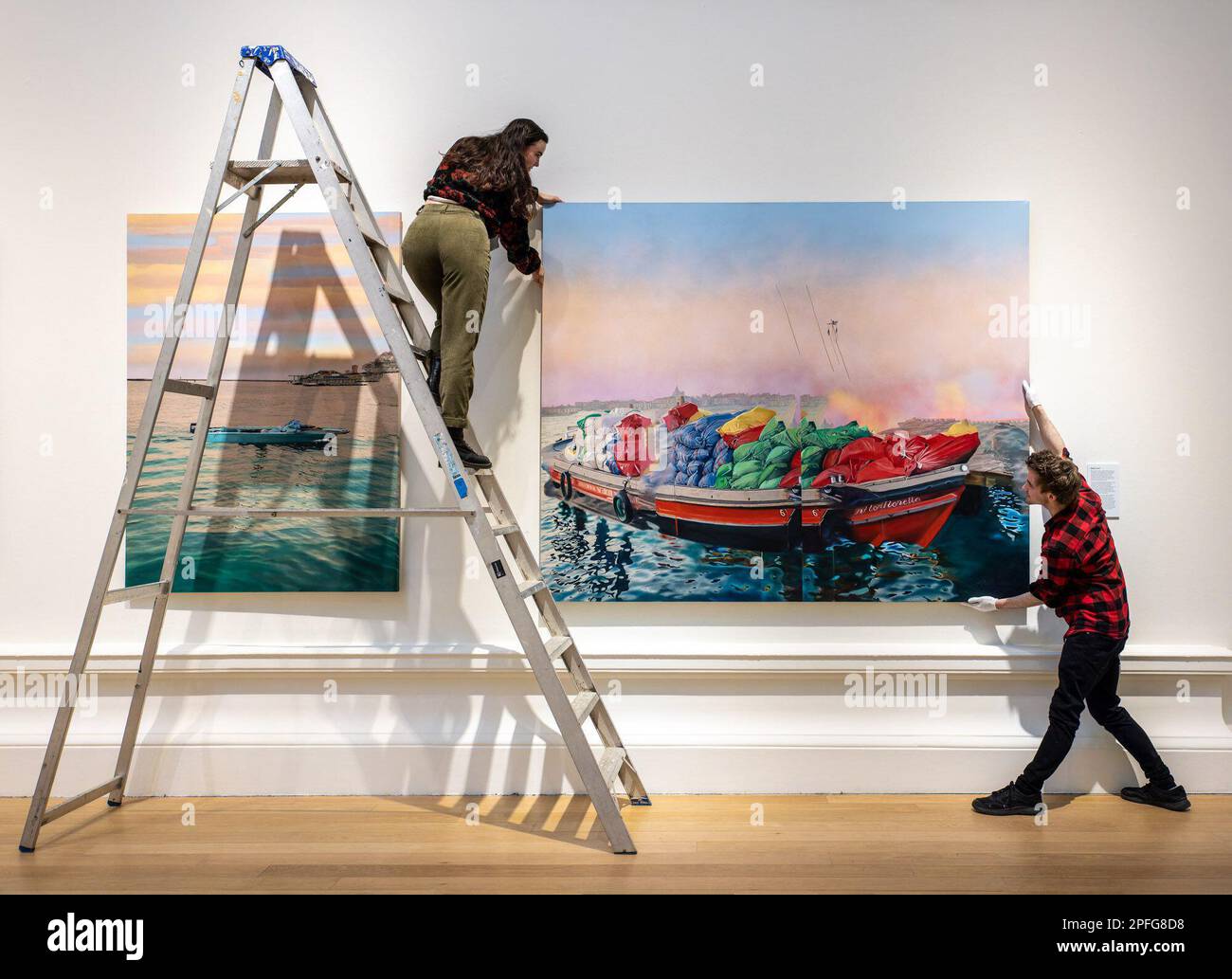 Edinburgh, United Kingdom. 17 March, 2023 Pictured: Gallery Assistants ...