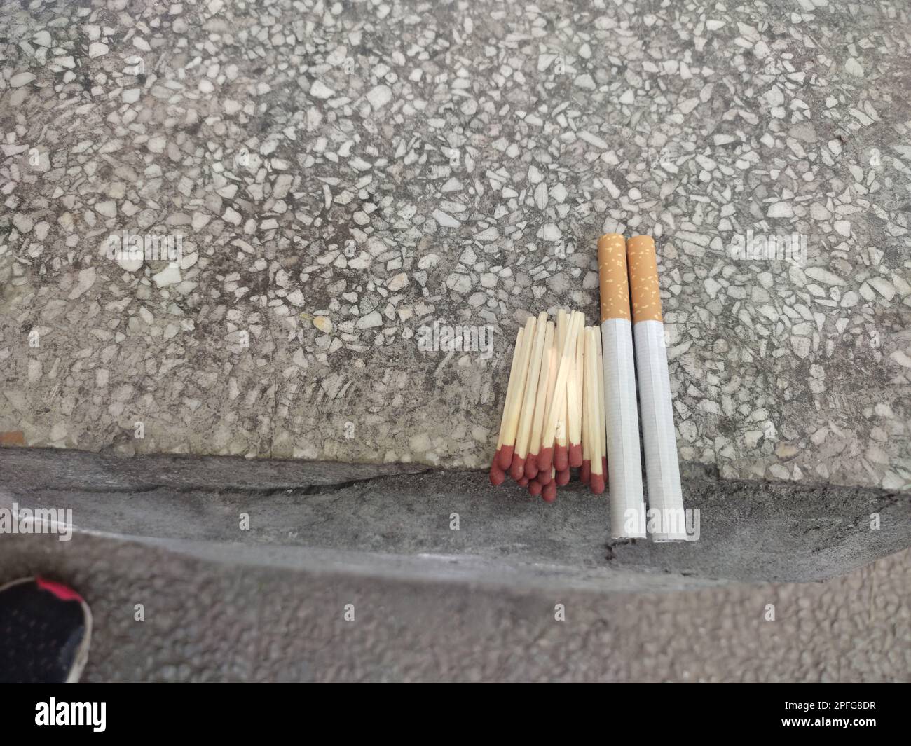 Close up of open single cardboard match box on granite stone background ...