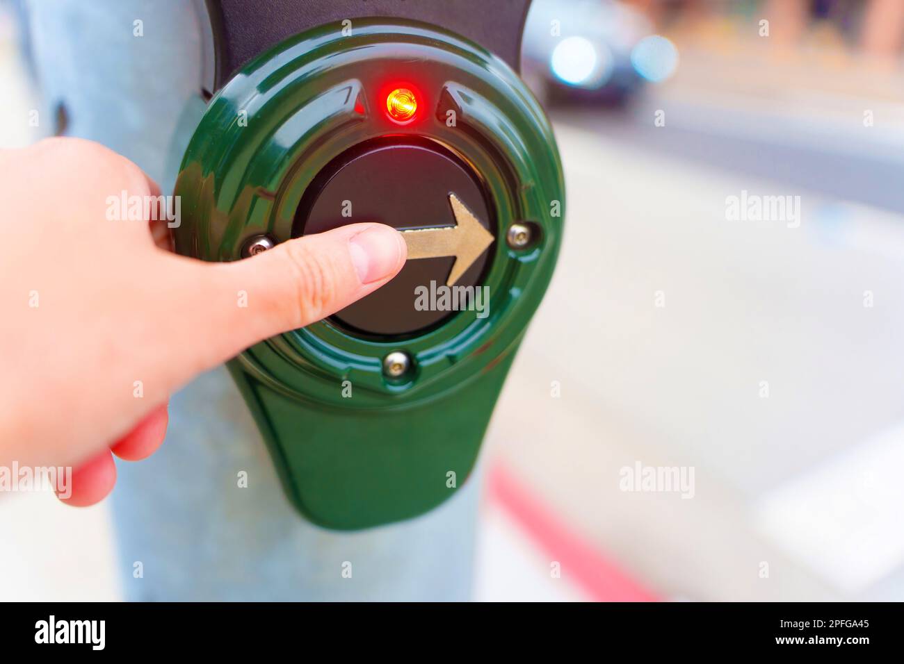 Hand pushes a pedestrian signal button to cross the walkway Stock Photo ...