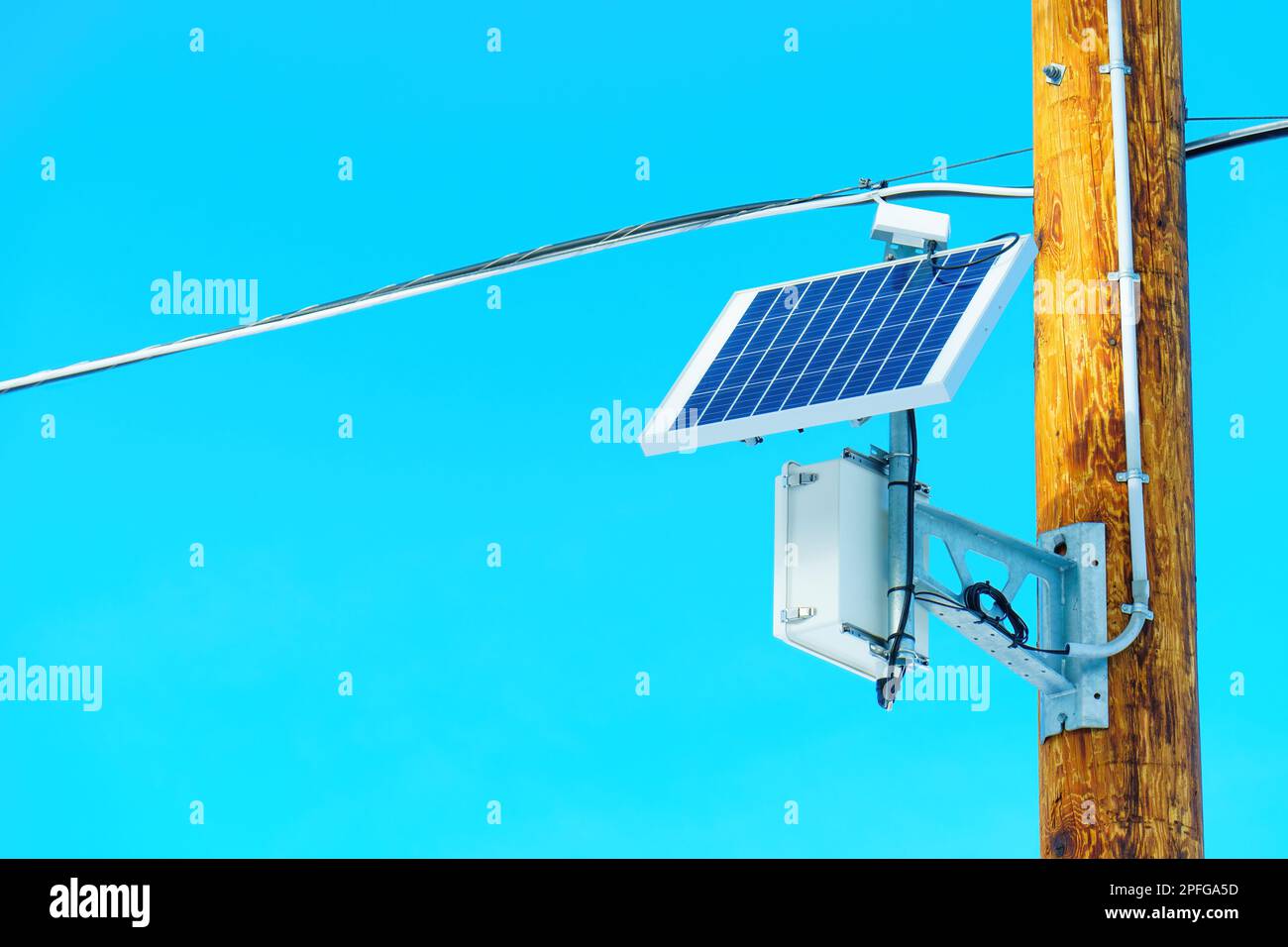 Solar panel and auxiliary equipment mounted on a wooden pole of an ...