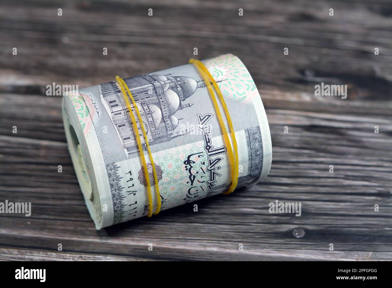 20 EGP LE twenty Egyptian pounds cash money bills rolled up with rubber ...
