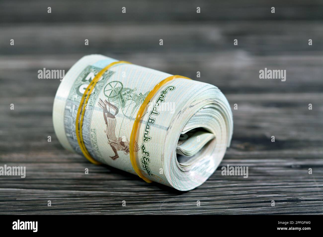 20 EGP LE twenty Egyptian pounds cash money bills rolled up with rubber ...