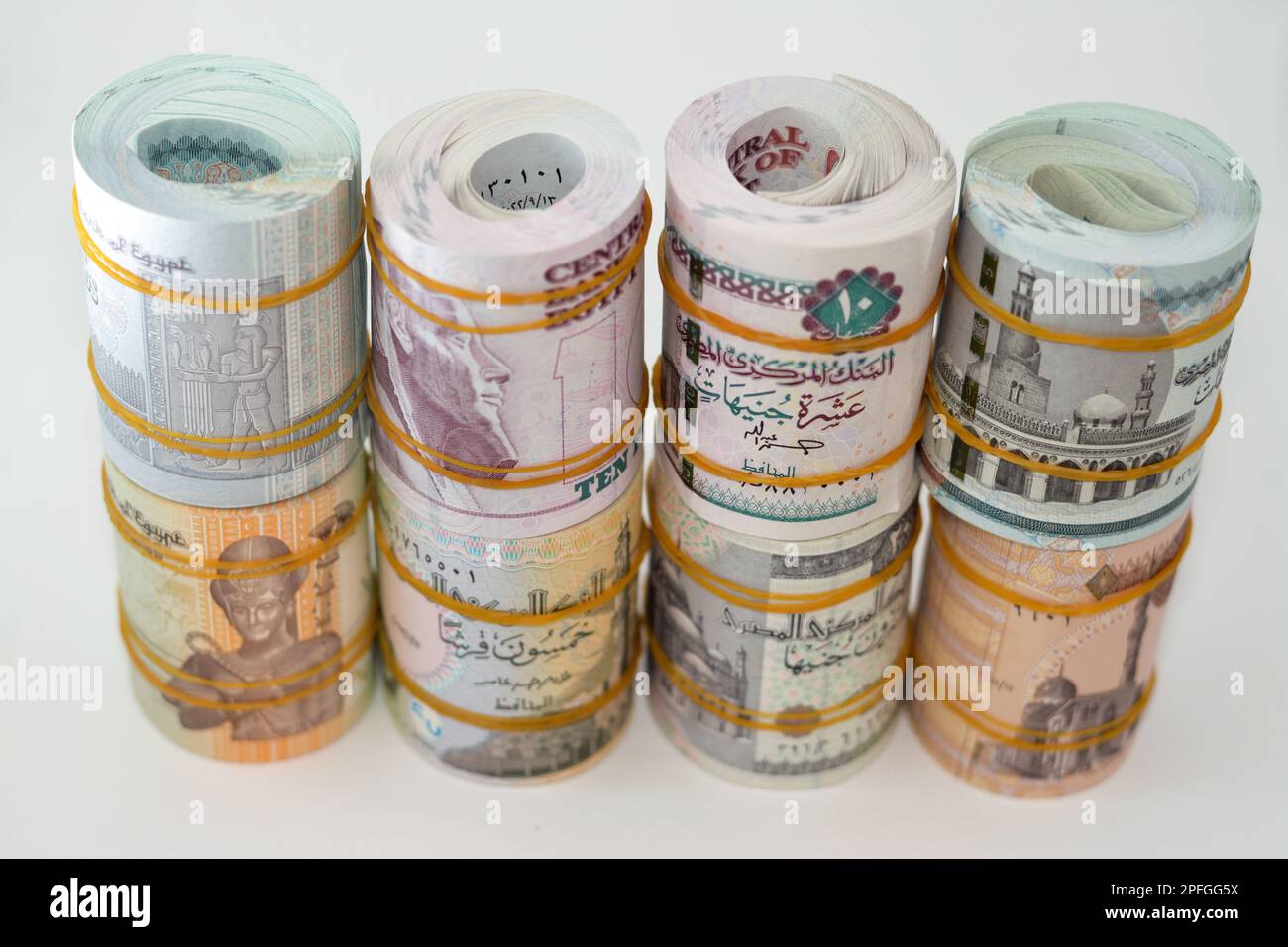 Background of bundles and rolls of Egyptian money currency cash ...