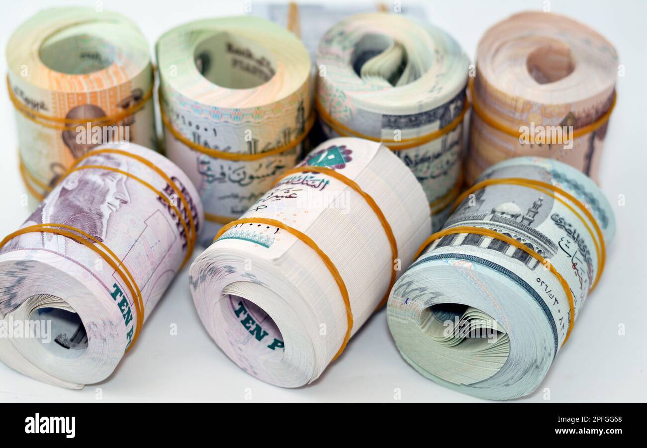 Background of bundles and rolls of Egyptian money currency cash ...