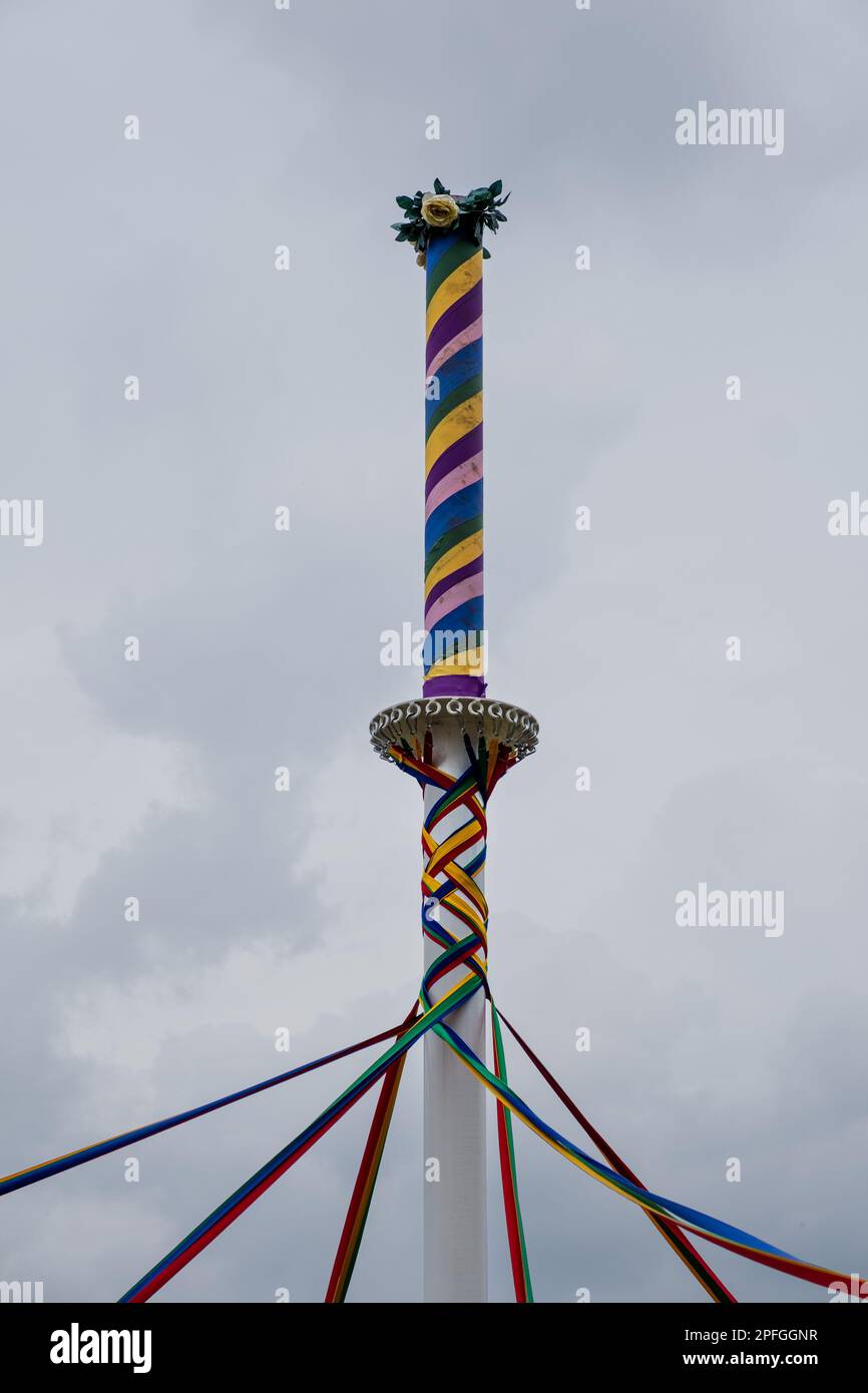 A low angle shot of a classic English Maypole during a dancing festival ...