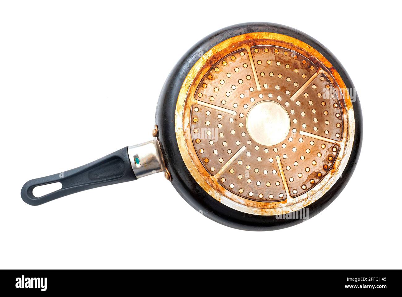 Bottom of an old used dirty frying pan isolated on white, top view ...