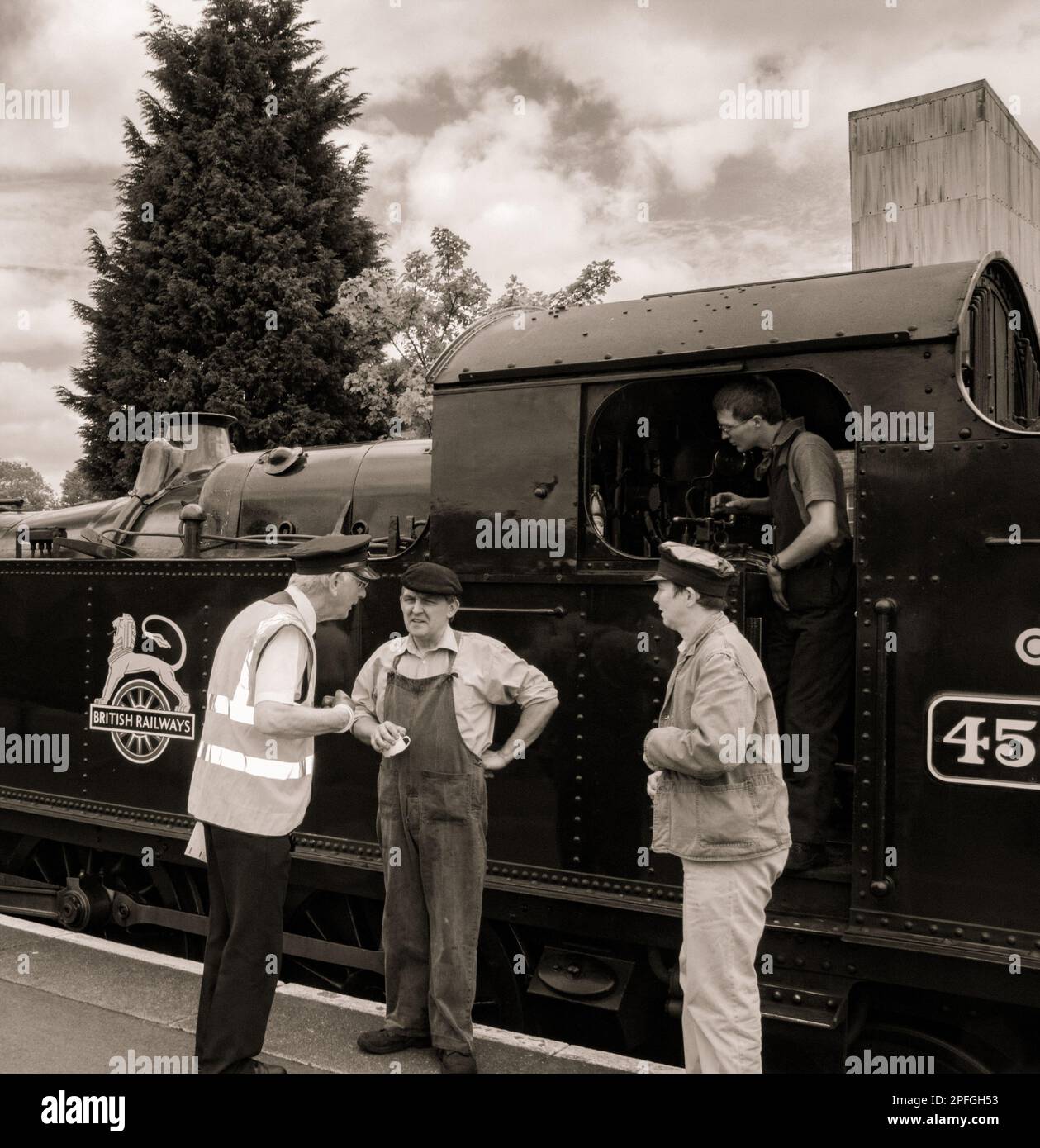 Steam train engineers having a meeting with the station master Stock ...