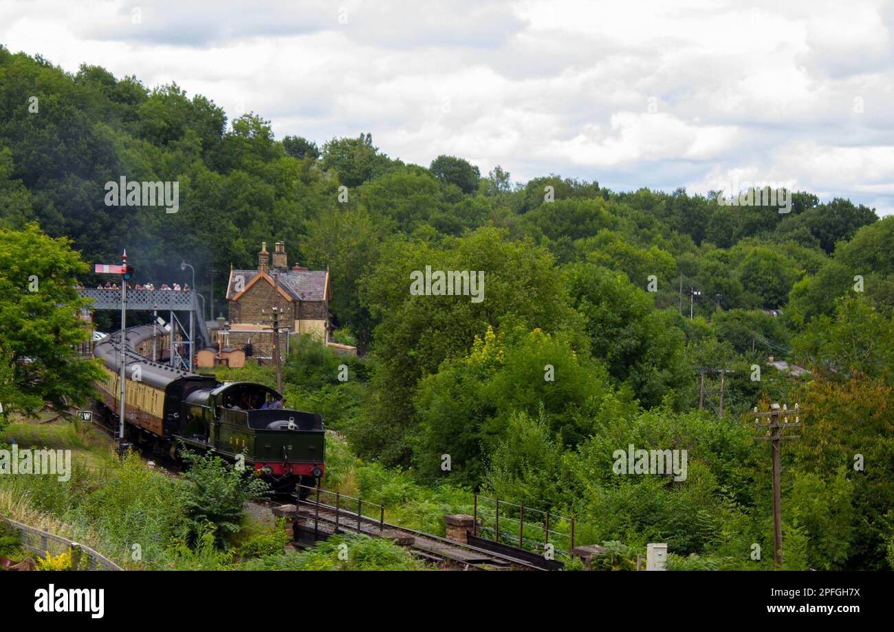 Steam train pulling into a rural station Stock Photo - Alamy
