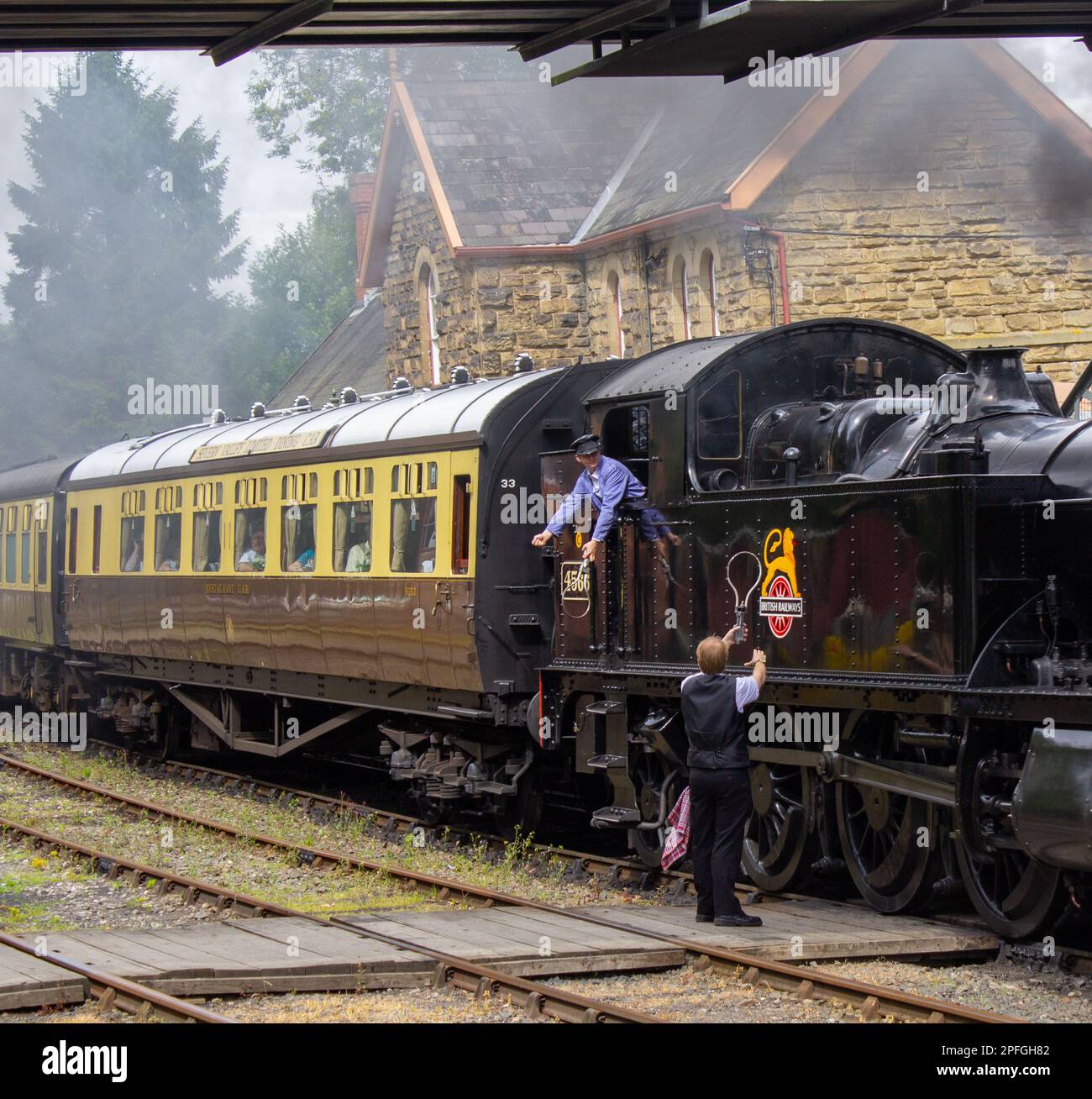 Steam railway. Driver and signal staff exchanging tokens Stock Photo ...