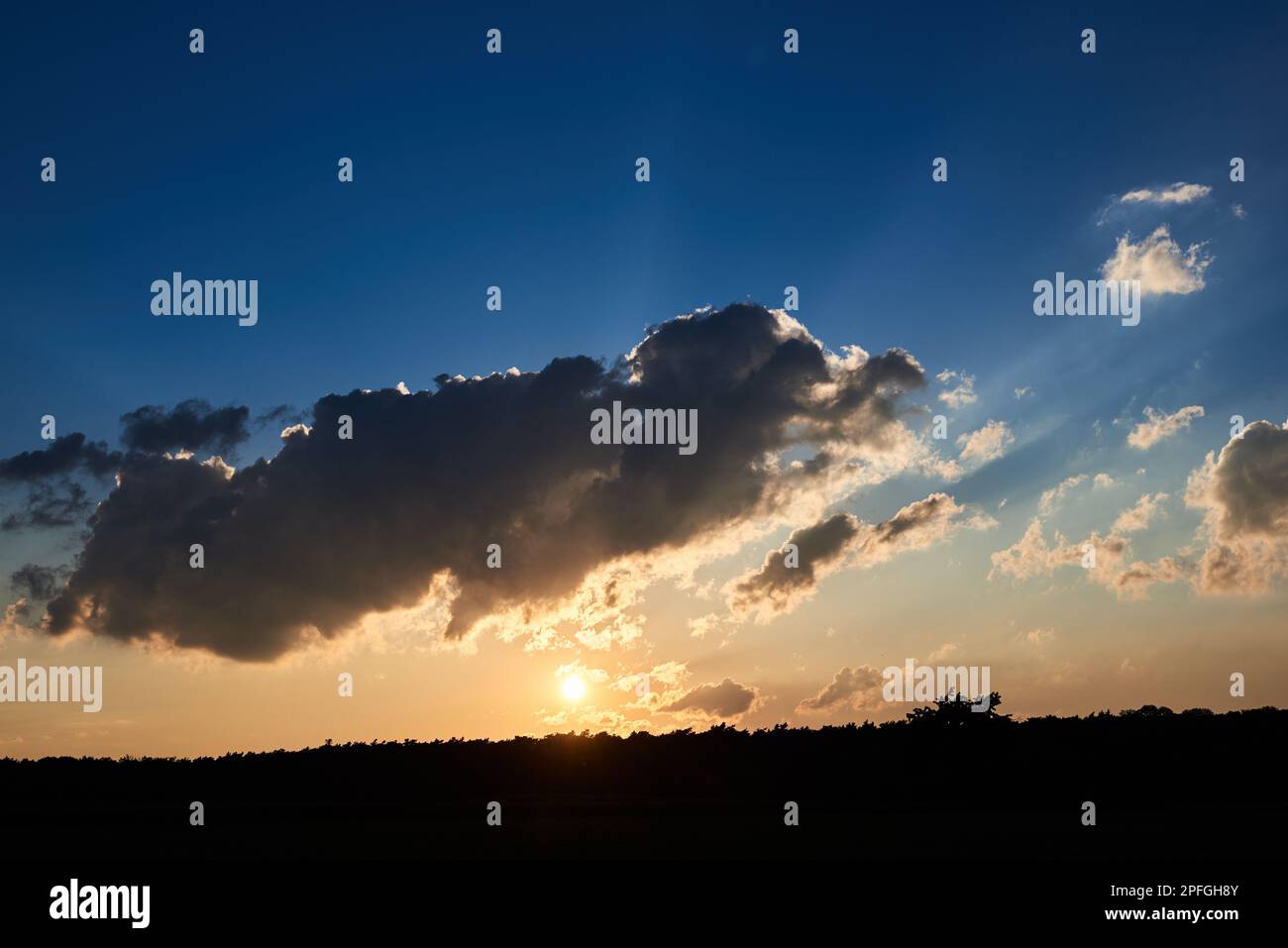Sky with clouds, with the setting sun Stock Photo - Alamy