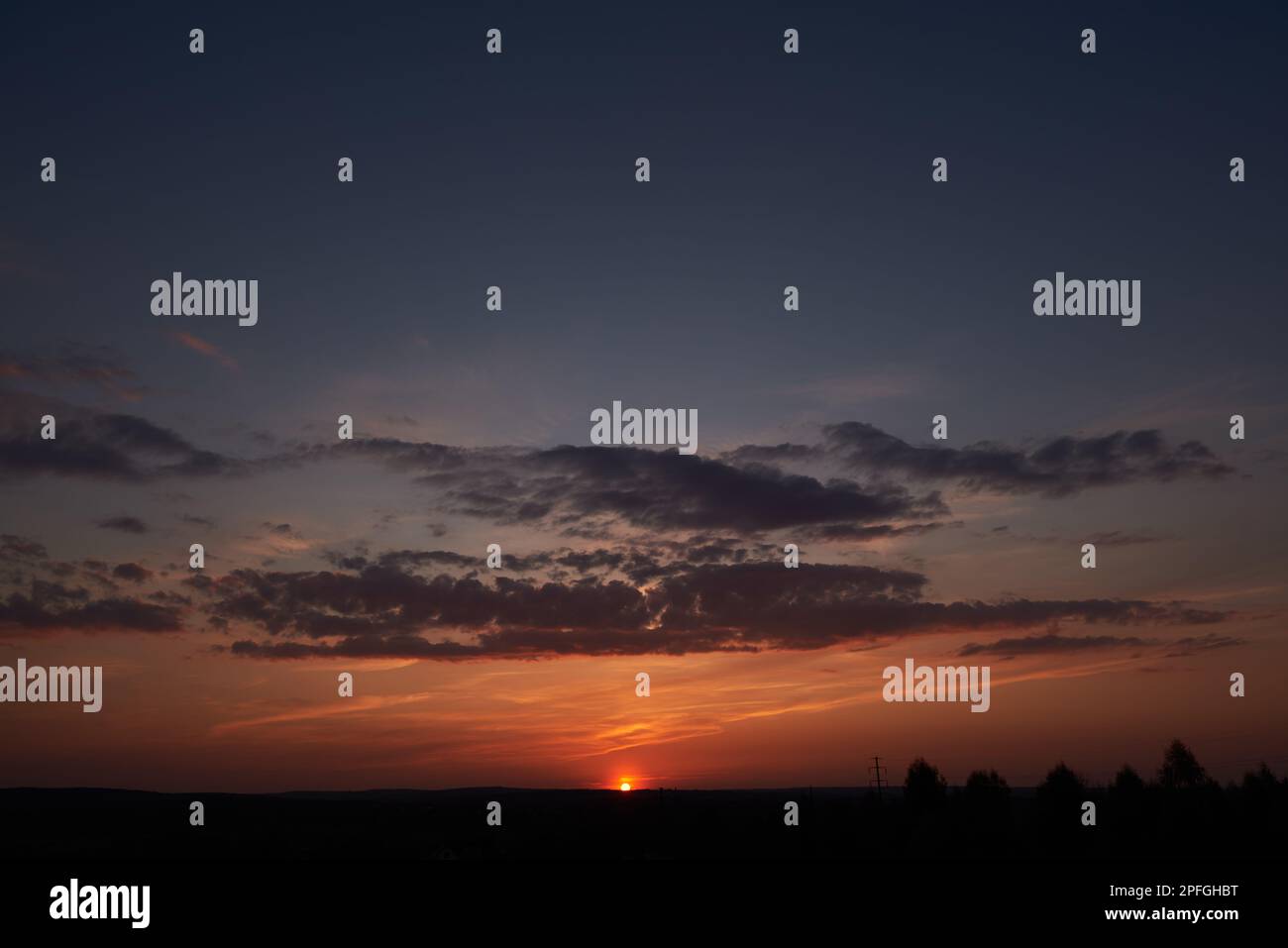 Sun setting through power hi-res stock photography and images - Alamy