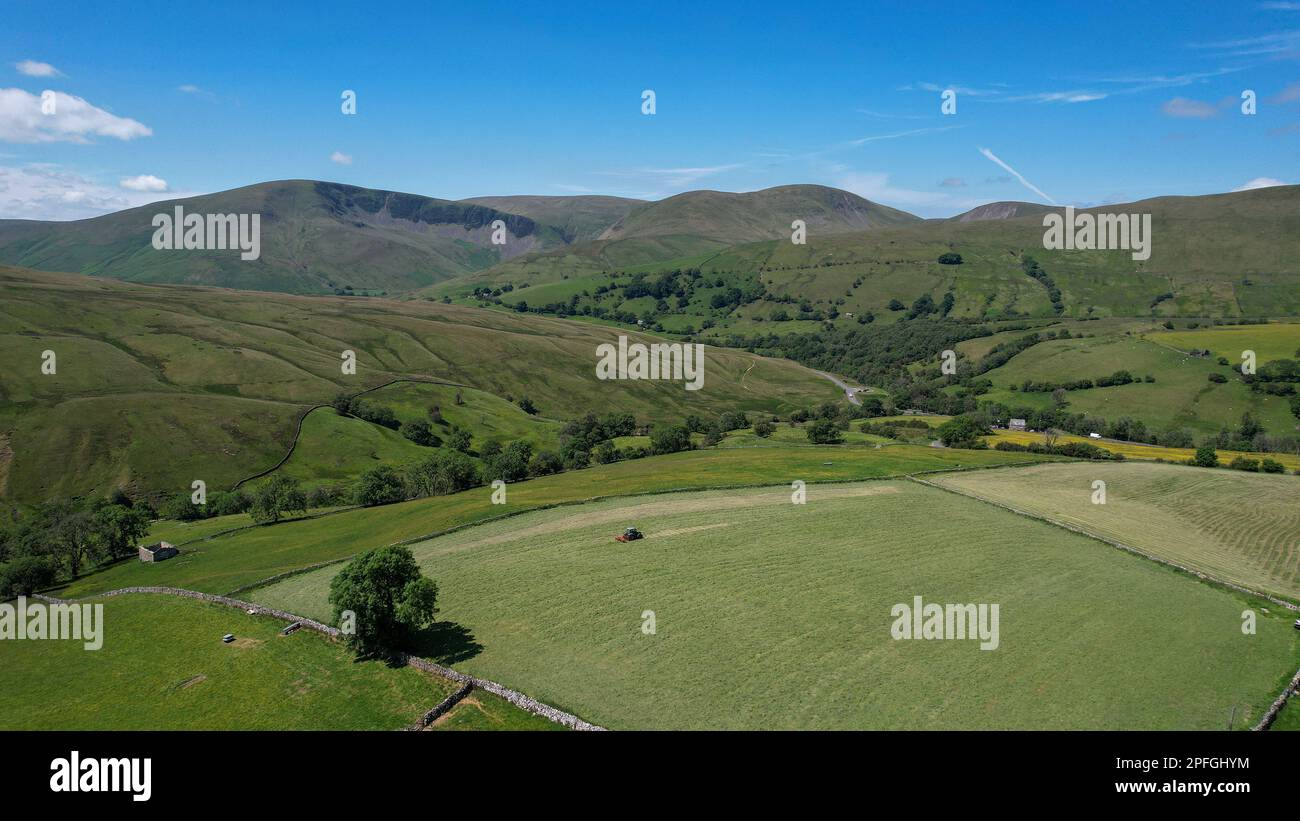 Mowing a traditional hay meadow on the edge of the Yorkshire Dales ...