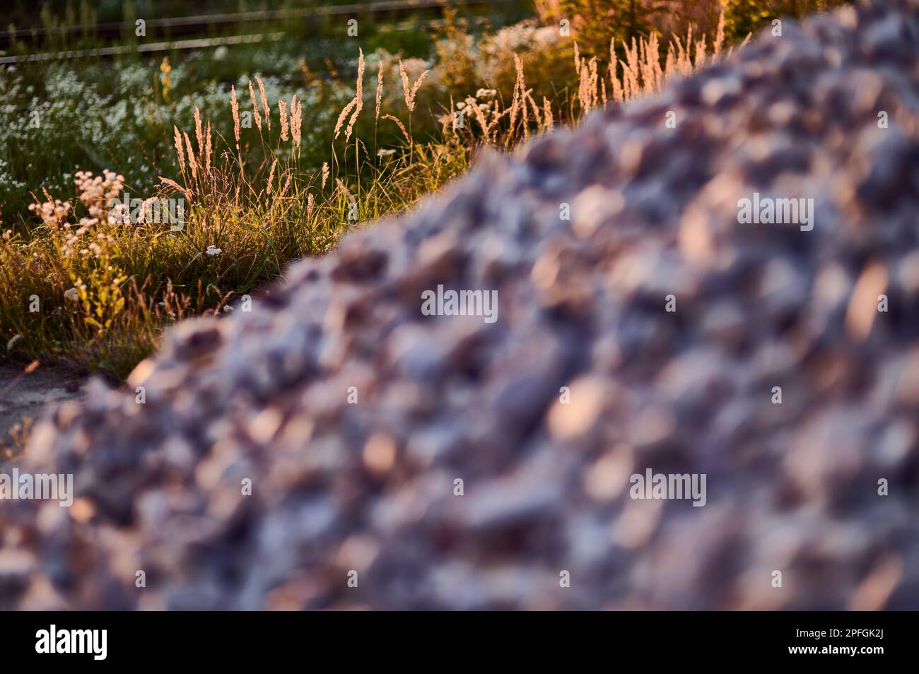 A heap of fine granite stones in the warm sunlight Stock Photo - Alamy
