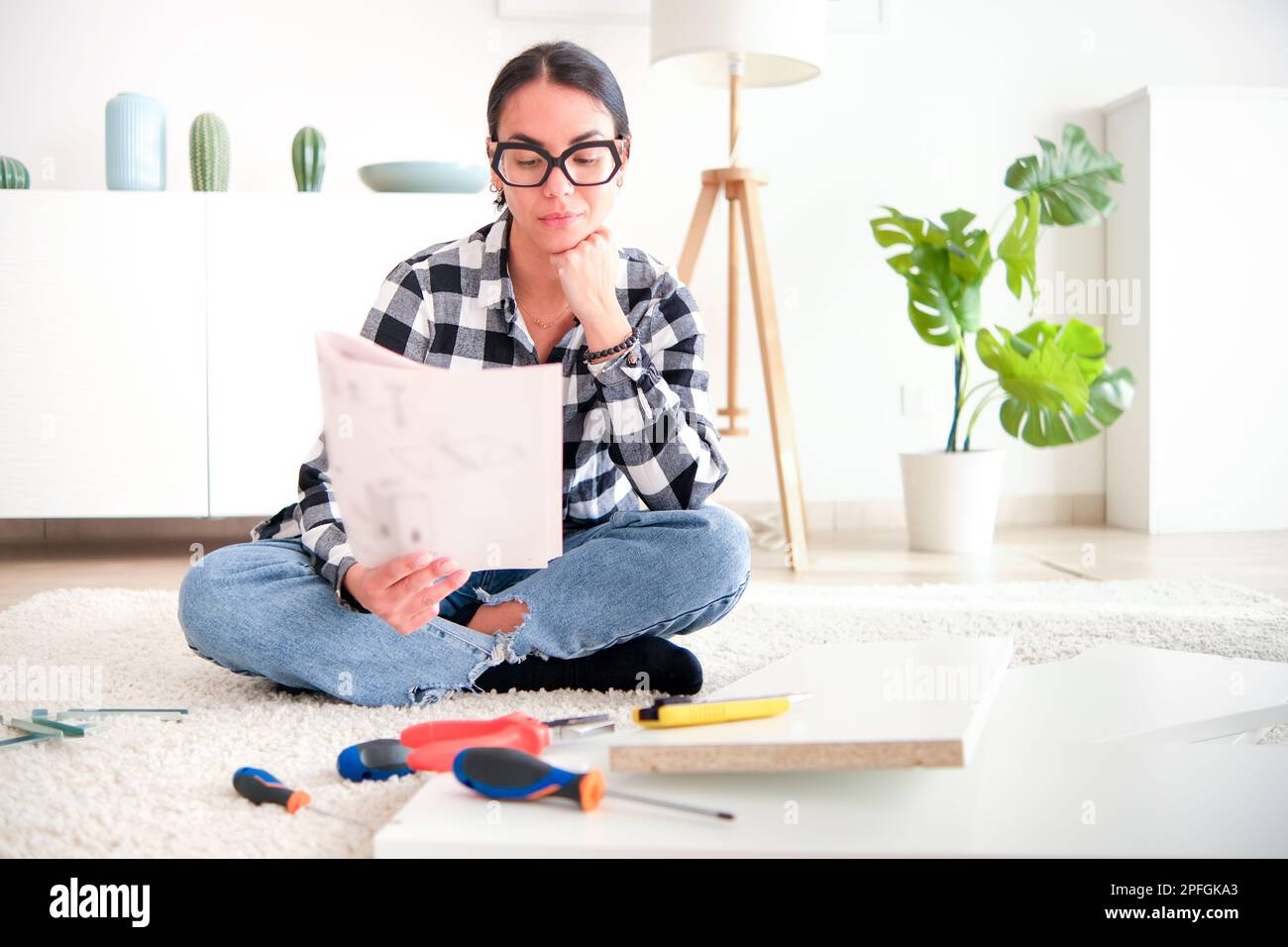 Home DIY renovation concept. Woman works to create something new and ...