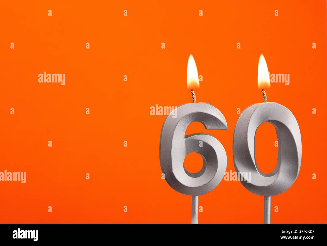 Candle number 60 - Birthday in orange background Stock Photo - Alamy