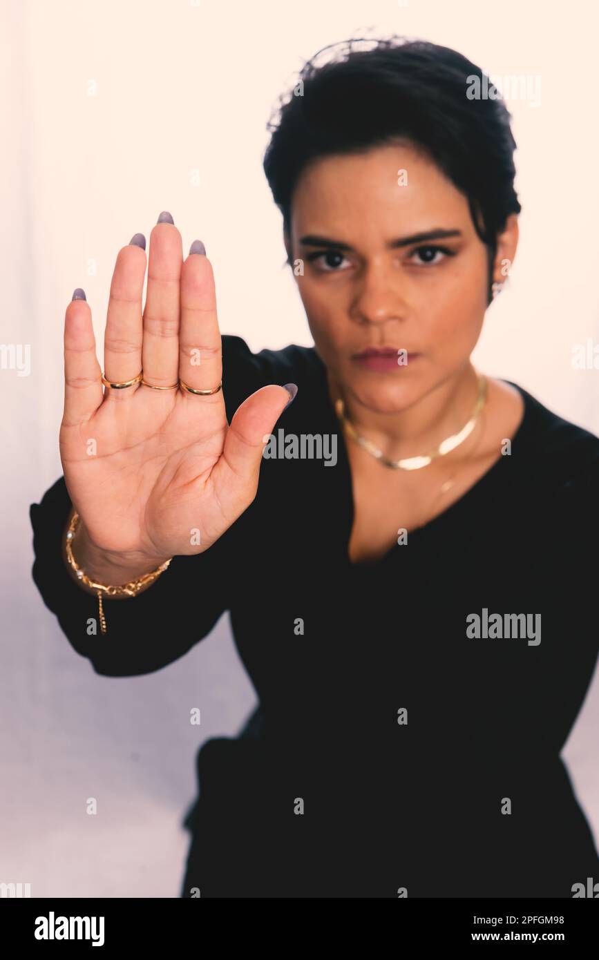 Young female lawyer making stop sign with her right hand. Isolated on ...