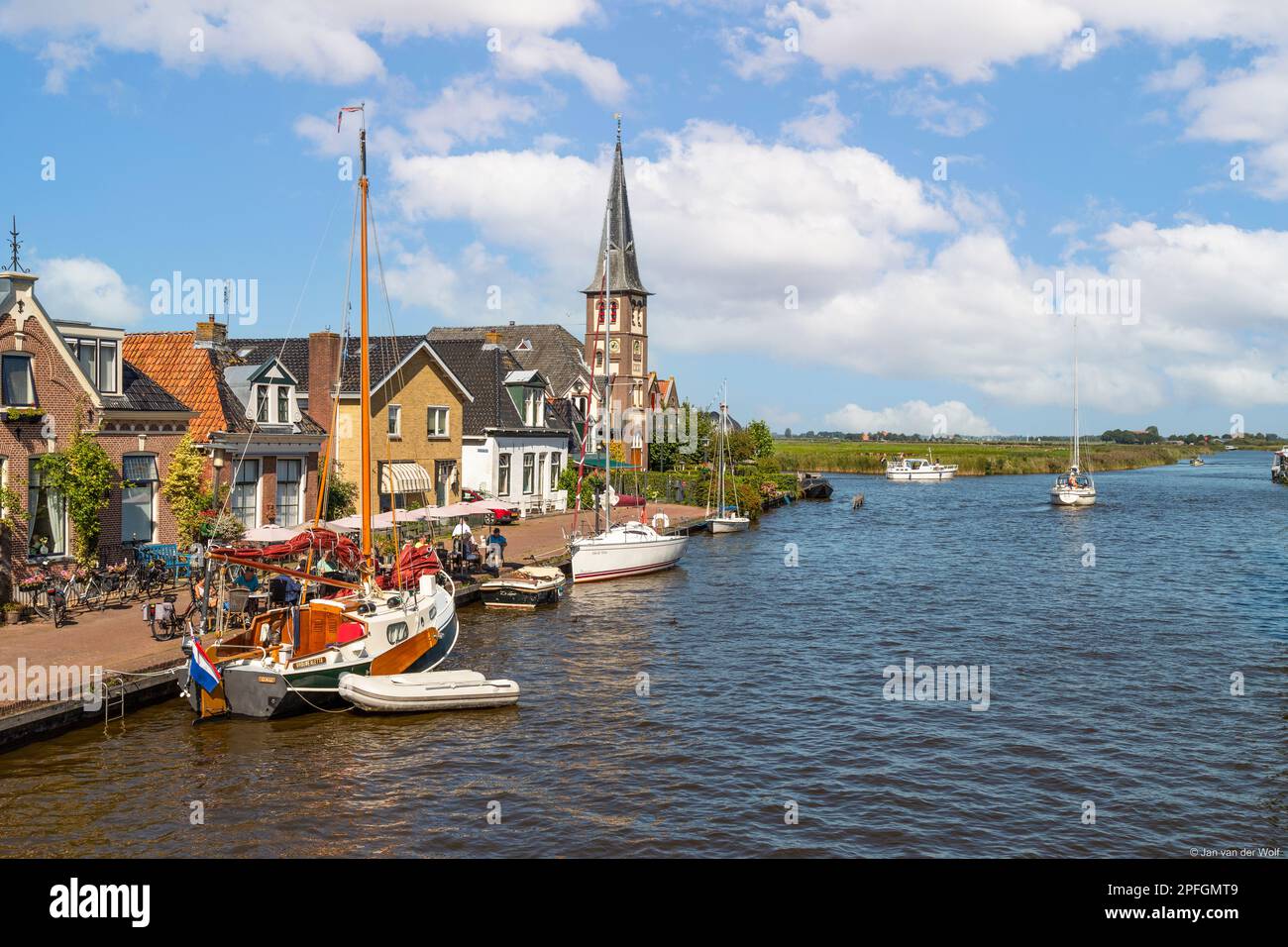 People enjoy the water in the picturesque town of Woudsend in Friesland ...