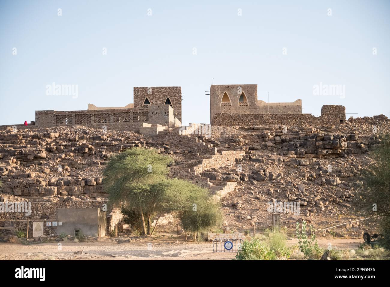 The crumbling stone walls and ruins of the ancient desert city of ...