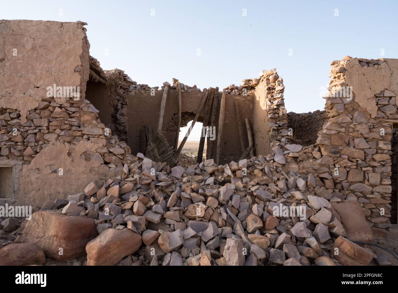 The crumbling stone walls and ruins of the ancient desert city of Oudane, a UNESCO World ...