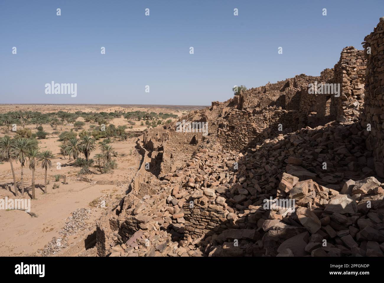 The crumbling stone walls and ruins of the ancient desert city of ...