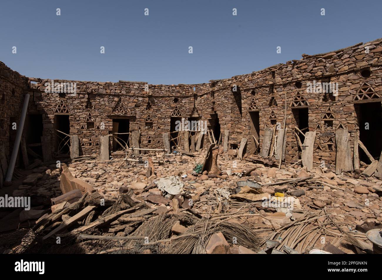 The crumbling stone walls and ruins of the ancient desert city of ...