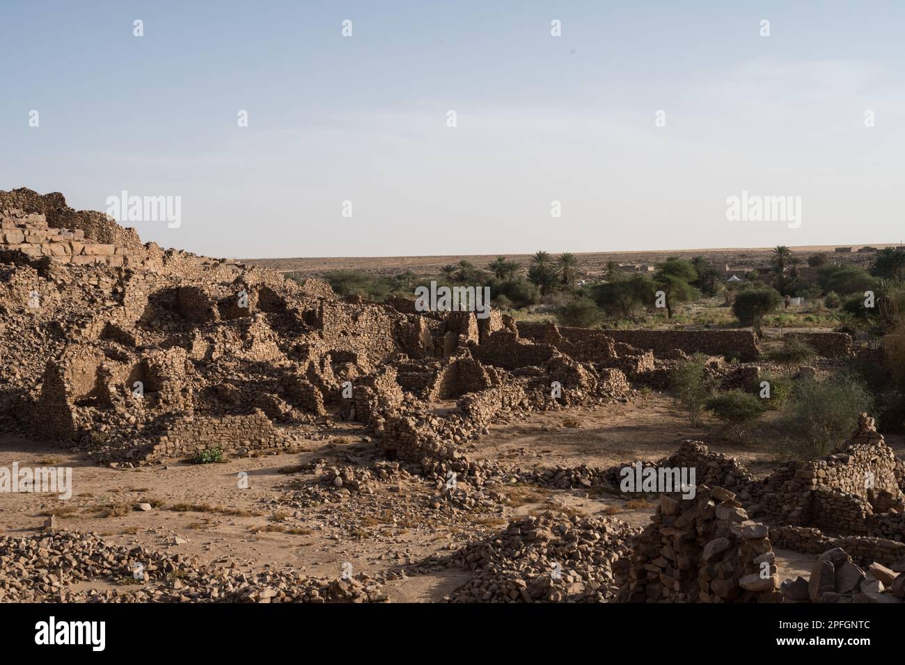The crumbling stone walls and ruins of the ancient desert city of ...