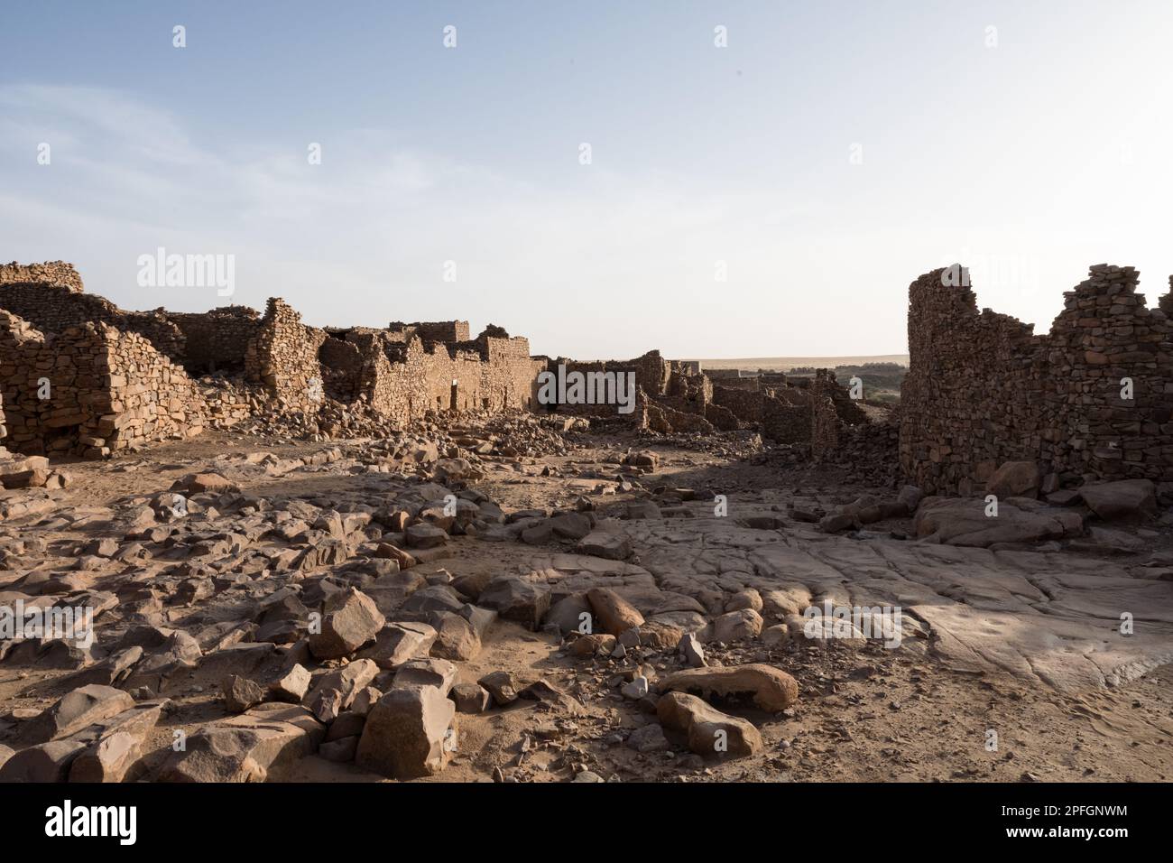 The crumbling stone walls and ruins of the ancient desert city of ...