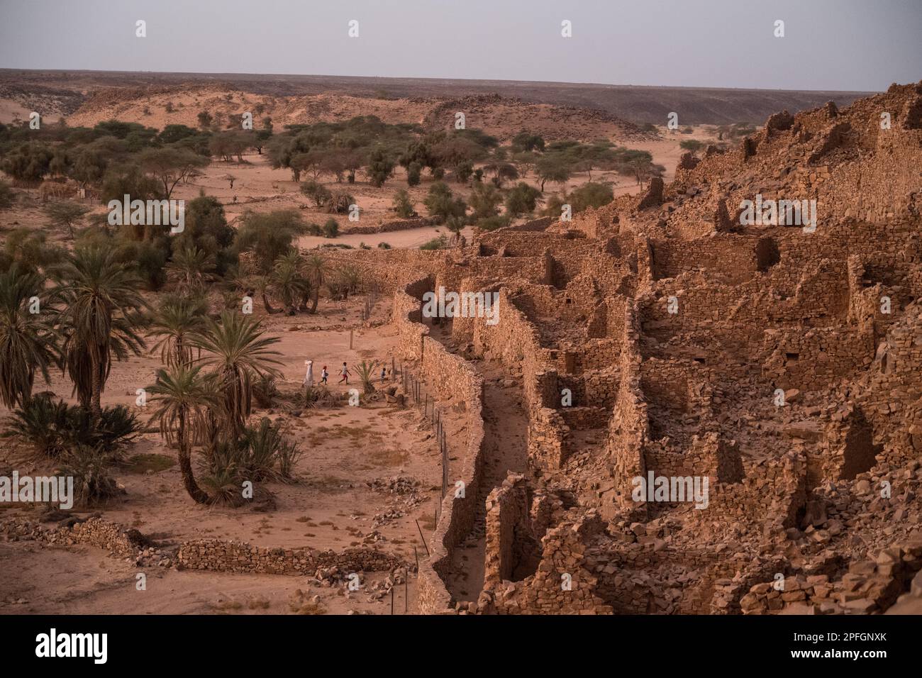 The crumbling stone walls and ruins of the ancient desert city of ...
