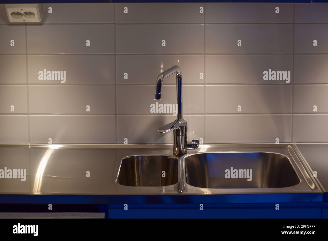 Modern interior of apartment. Luxury grey kitchen set. Huge sink. Built ...