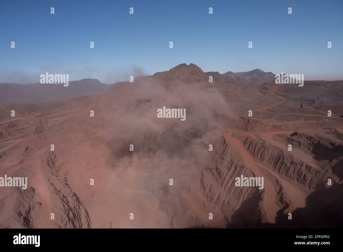 Trucks loading iron ore at the SNIM open-pit iron ore mine. Zouerat ...