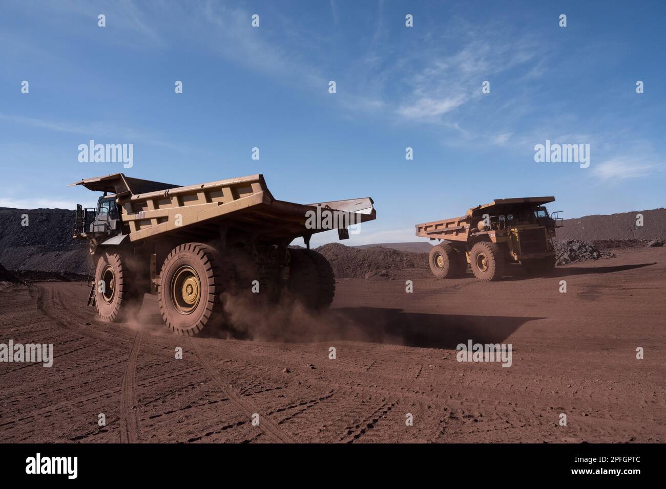Trucks loading iron ore at the SNIM open-pit iron ore mine. Zouerat ...