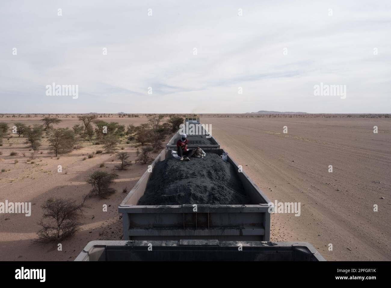 Adventure traveler on top of the Iron Ore Train from Zouerat to ...
