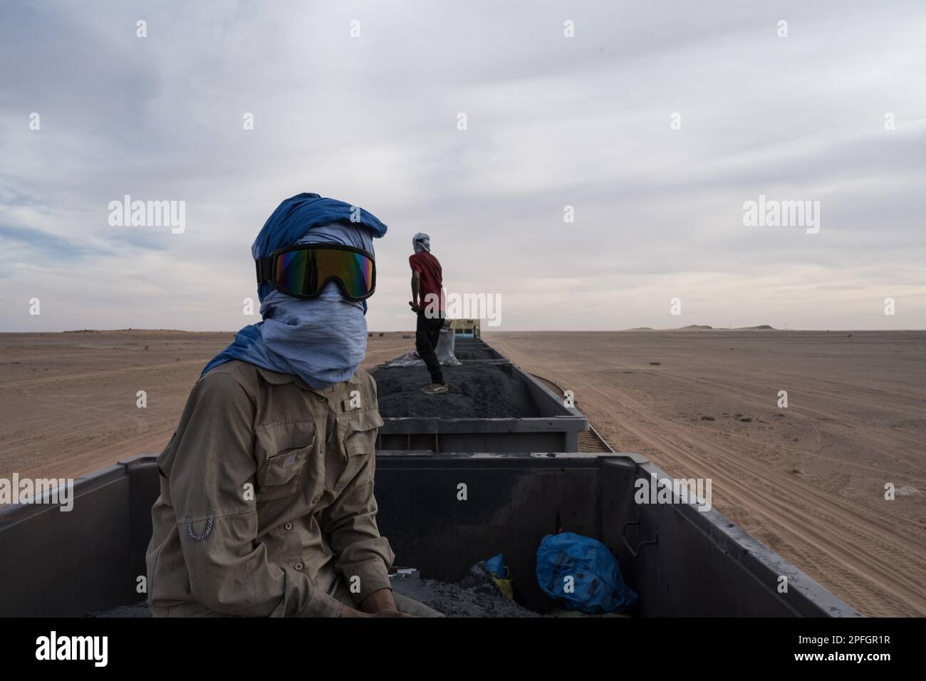 Adventure traveler on top of the Iron Ore Train from Zouerat to ...