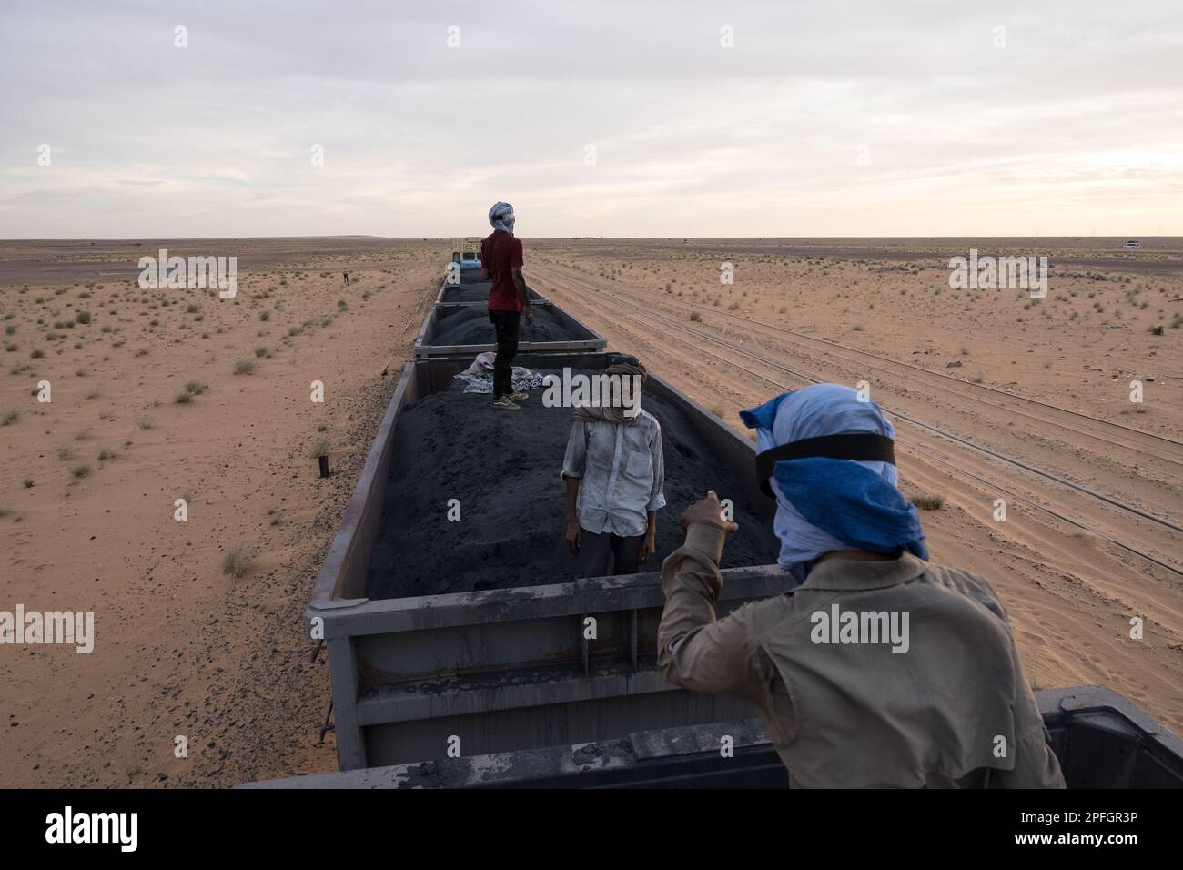 Adventure traveler on top of the Iron Ore Train from Zouerat to ...